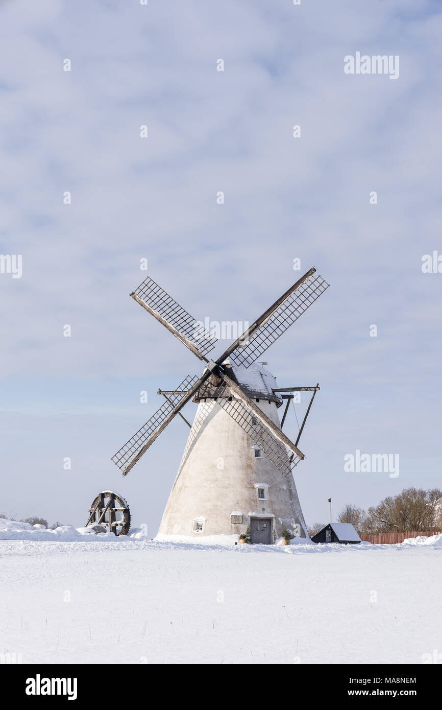 Grain mill on the winter landscape. Dutch windmill and natural ...