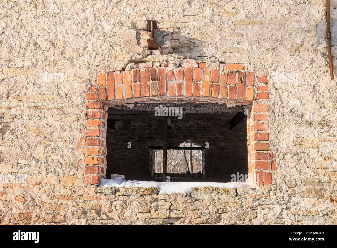Stone wall texture and windows with red frames, natural background ...