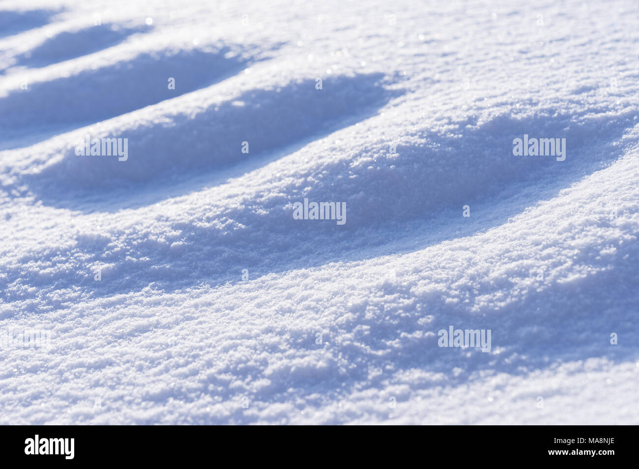 White snow and blue shadows, natural background Stock Photo - Alamy