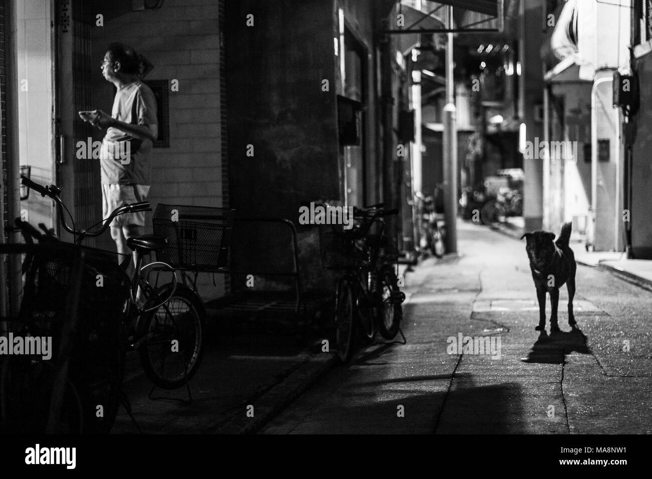 Woman stands near white Black and White Stock Photos & Images - Alamy