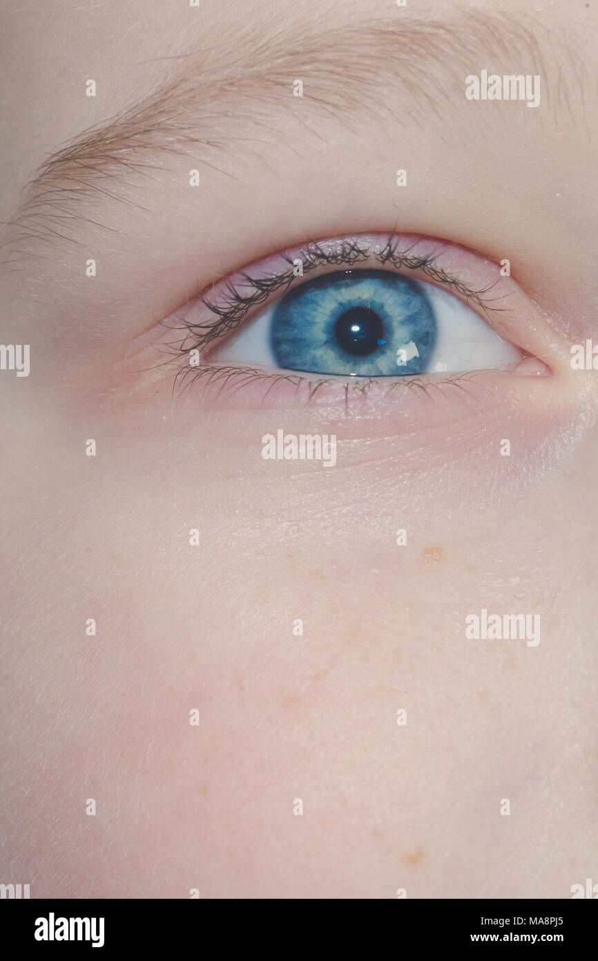 Baby blue beautiful, brooding eyes of a boy Stock Photo - Alamy