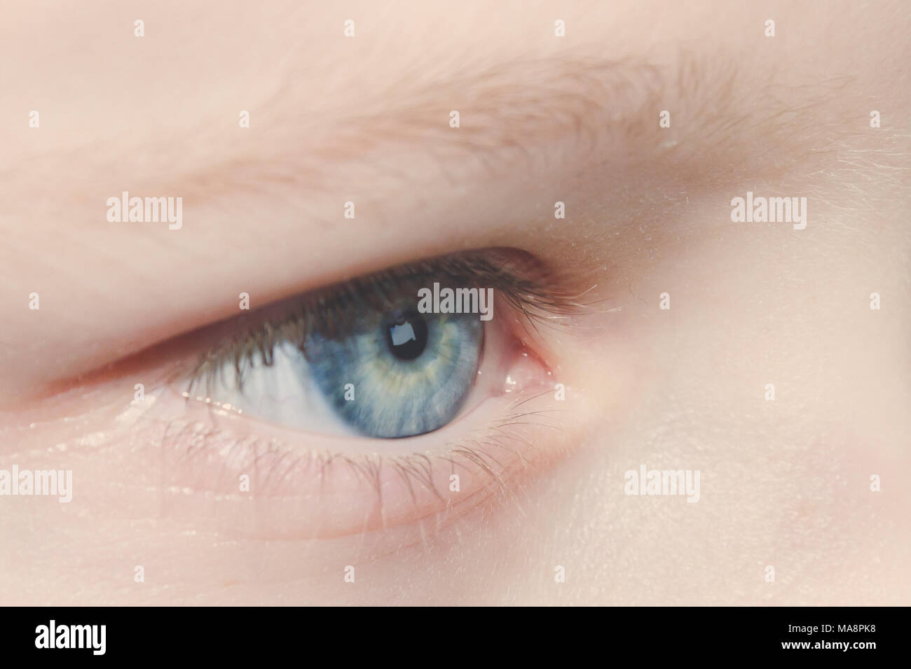 Baby blue beautiful, brooding eyes of a boy Stock Photo - Alamy
