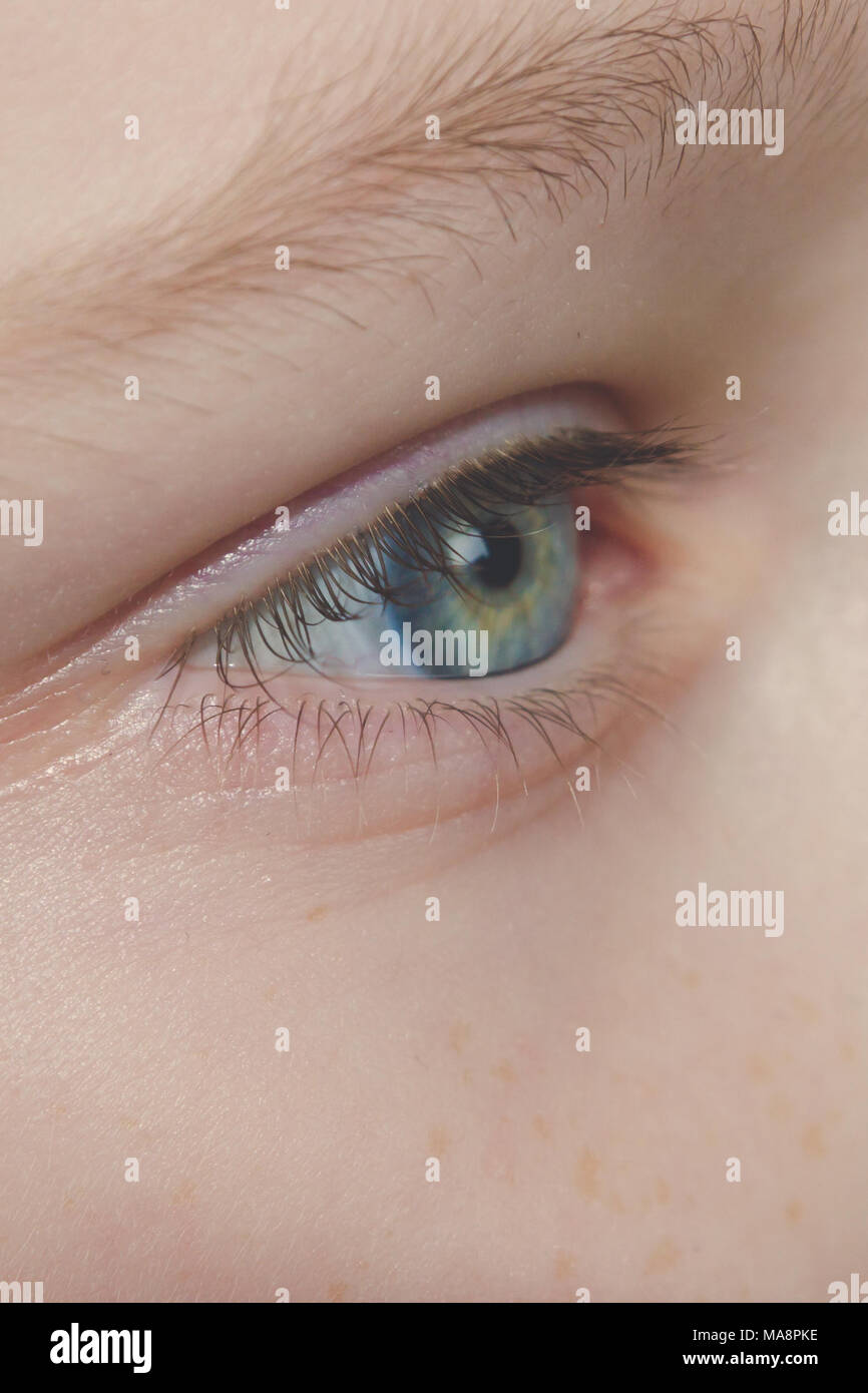 Baby blue beautiful, brooding eyes of a boy Stock Photo - Alamy