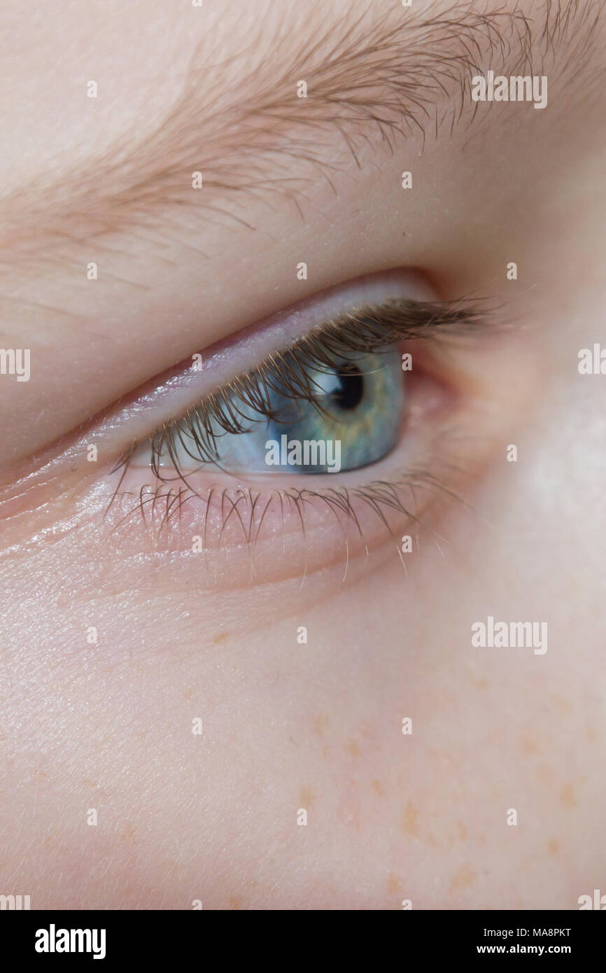 Baby blue beautiful, brooding eyes of a boy Stock Photo - Alamy