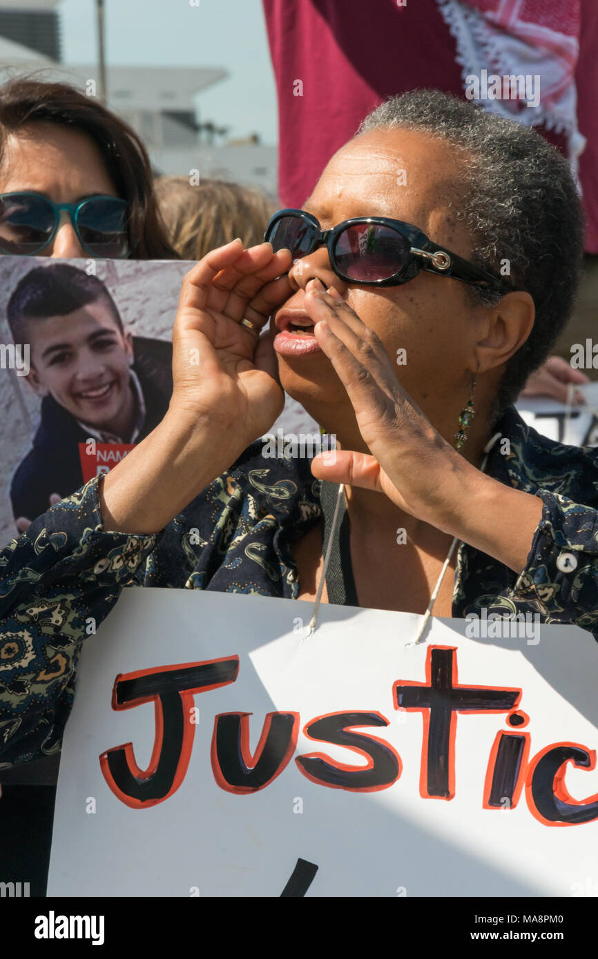 A woman shouts for justice for Jimmy Mubenga at the at Stop G4S protest ...