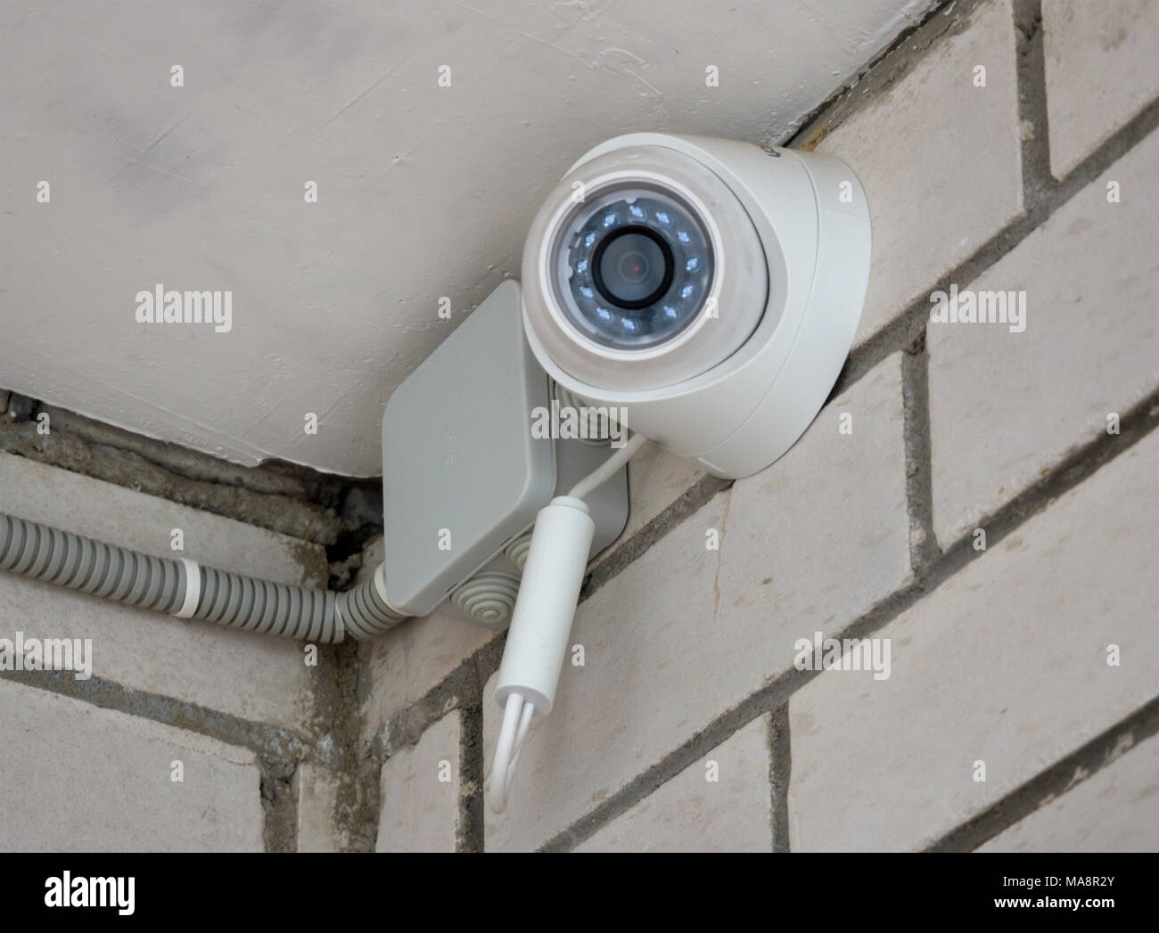 Surveillance camera hanging on the wall hi-res stock photography and ...