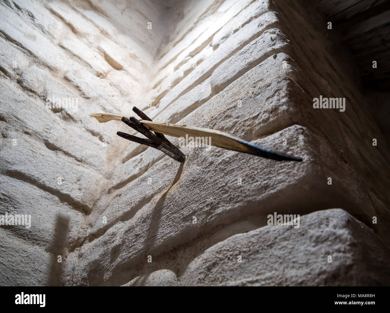 Ancient ray in a holder on a stone wall Stock Photo - Alamy