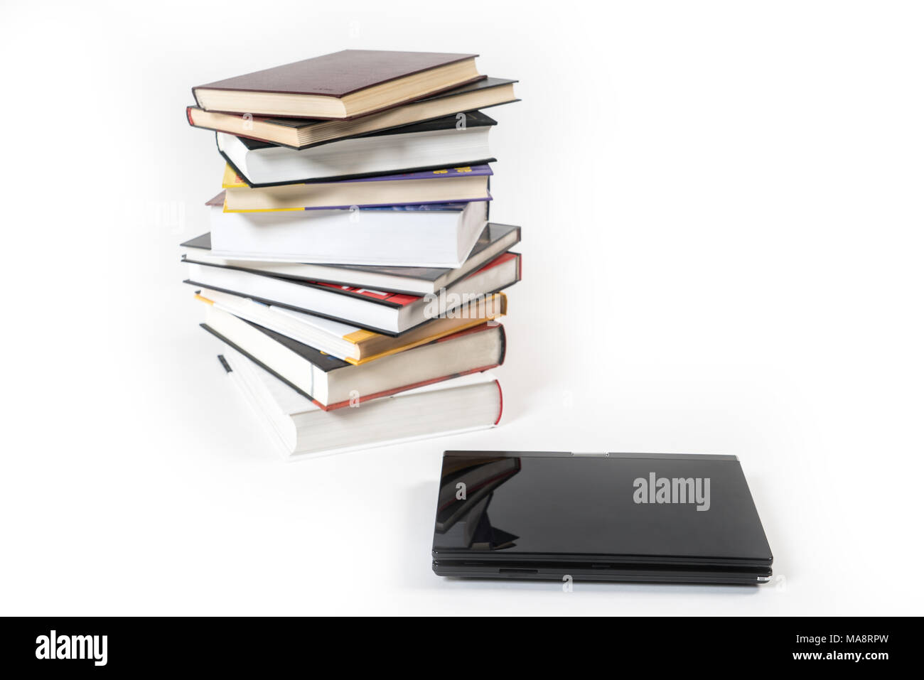 Stack of book and laptop isolated on white Stock Photo - Alamy