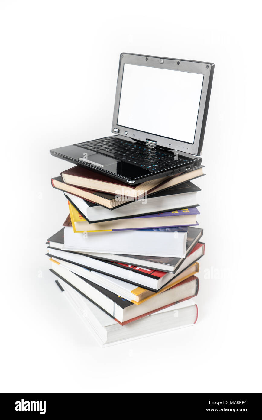 Stack of book and laptop isolated on white Stock Photo - Alamy