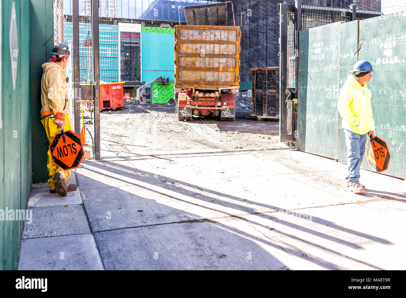 Slow down men work sign hi-res stock photography and images - Alamy