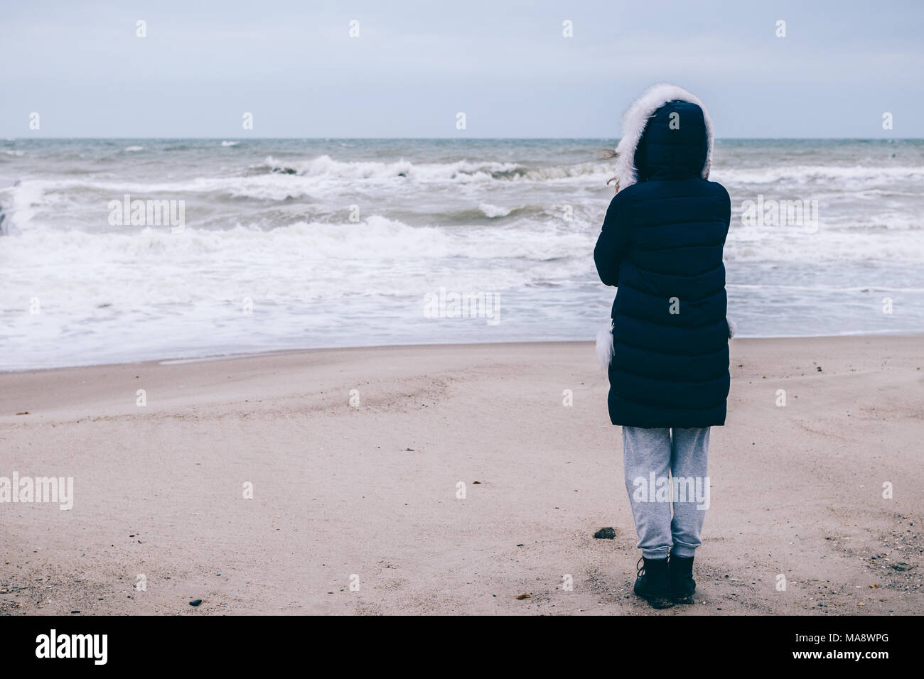 Woman coat back windy hi-res stock photography and images - Alamy