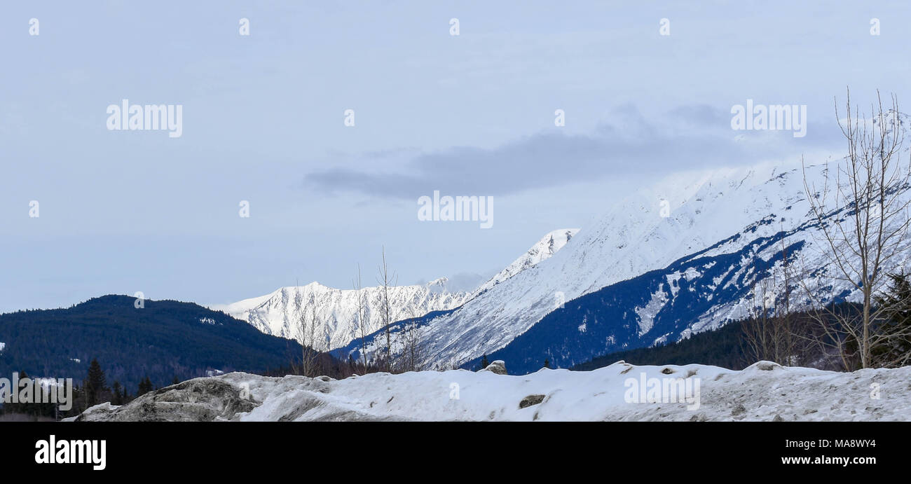 Snow Capped Peaks in the Spring in Alaska Stock Photo - Alamy