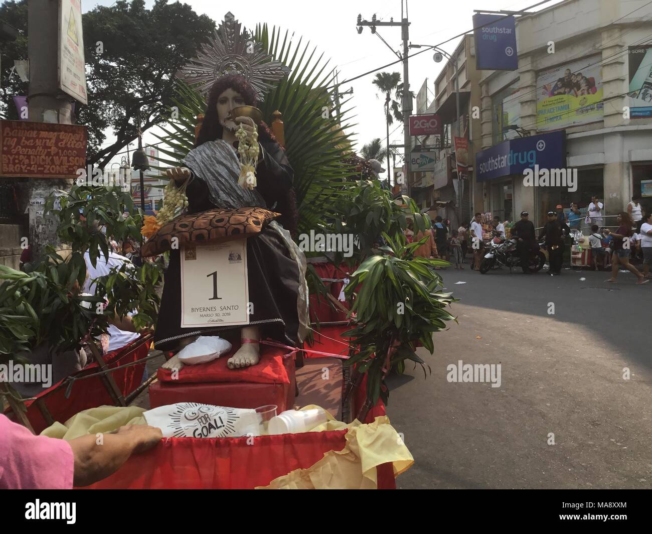 Pasay City, Philippines, 30 Mar 2018. A parade of religious images and ...