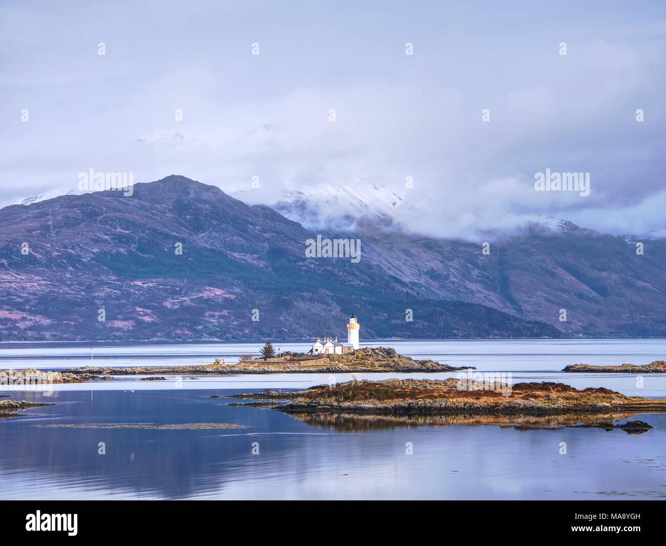 Iasle Ornsay Lighthouse built on a small islet located on the ferry ...