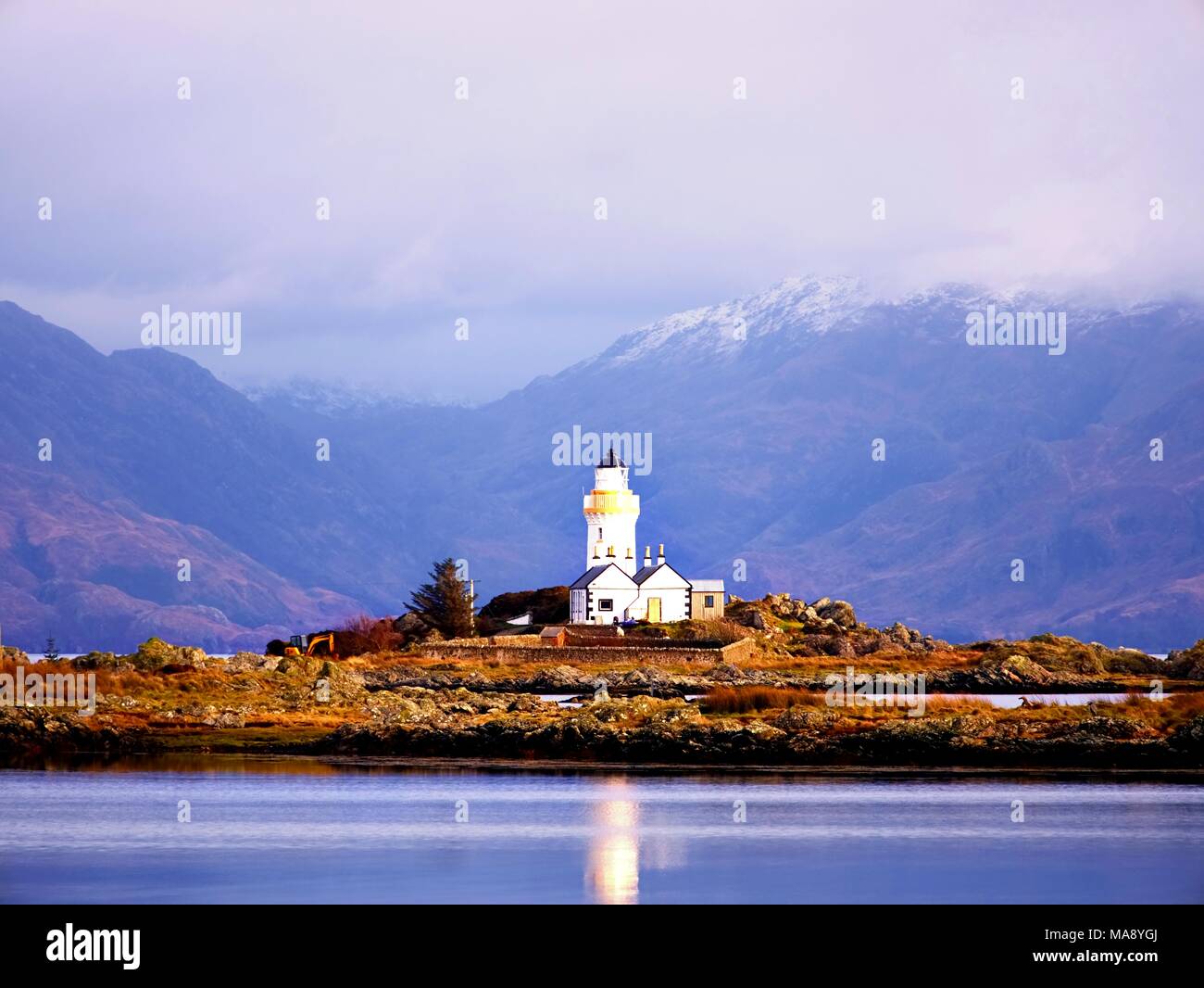 Popular view to Isle Ornsay Lighthouse. Rocky island south-east of Isle ...