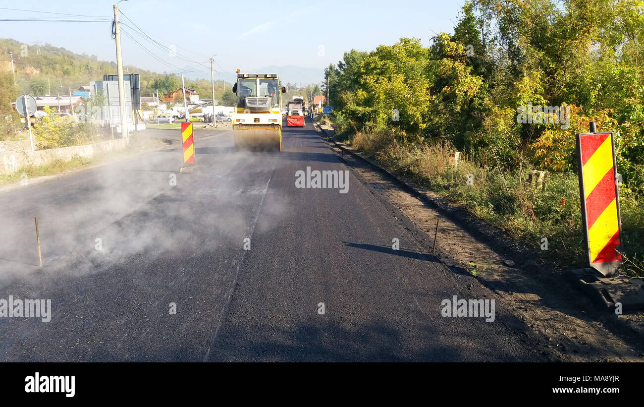 Road construction machinery in activity Stock Photo - Alamy