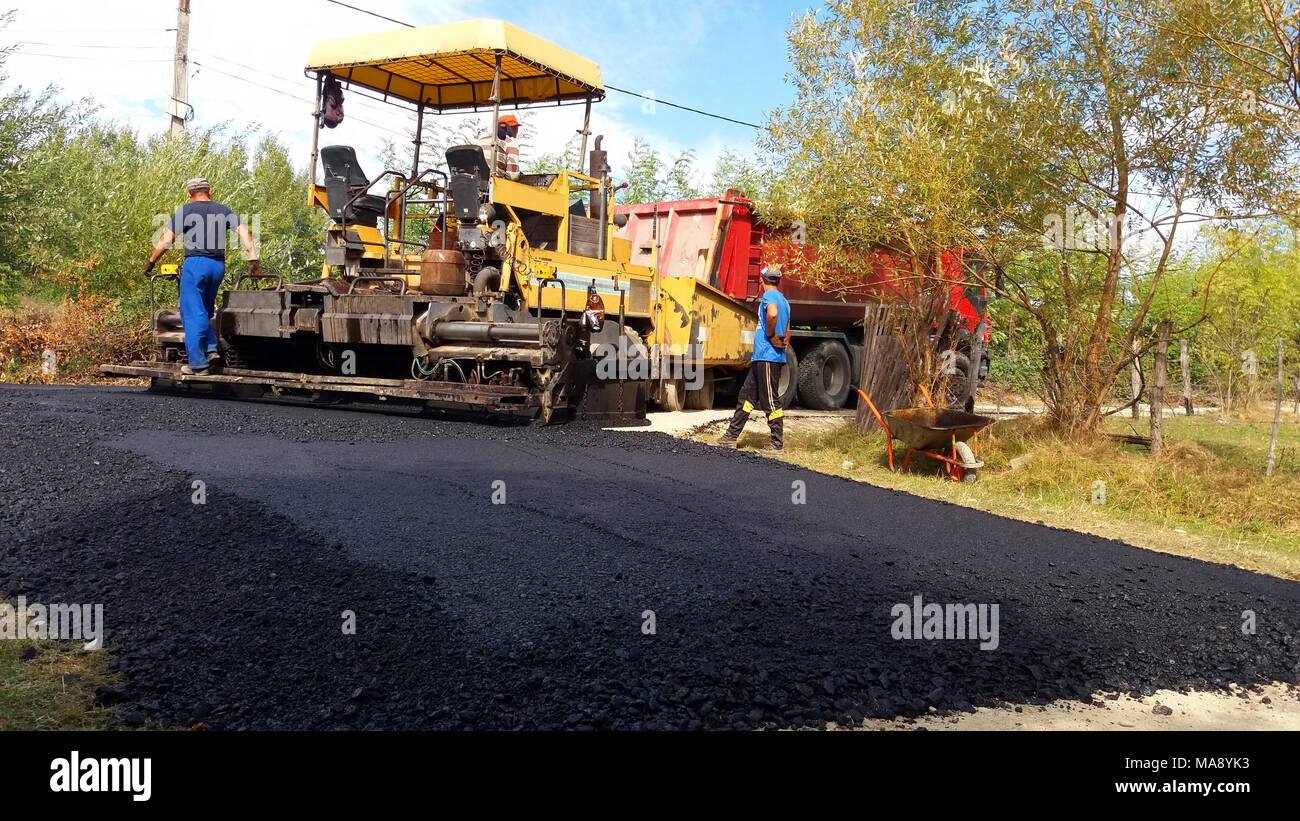 Road construction machinery in activity Stock Photo - Alamy