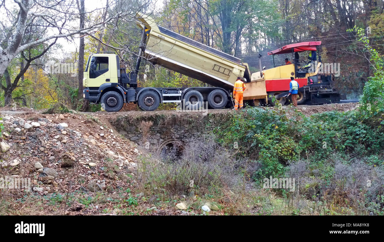 Road construction machinery in activity Stock Photo - Alamy