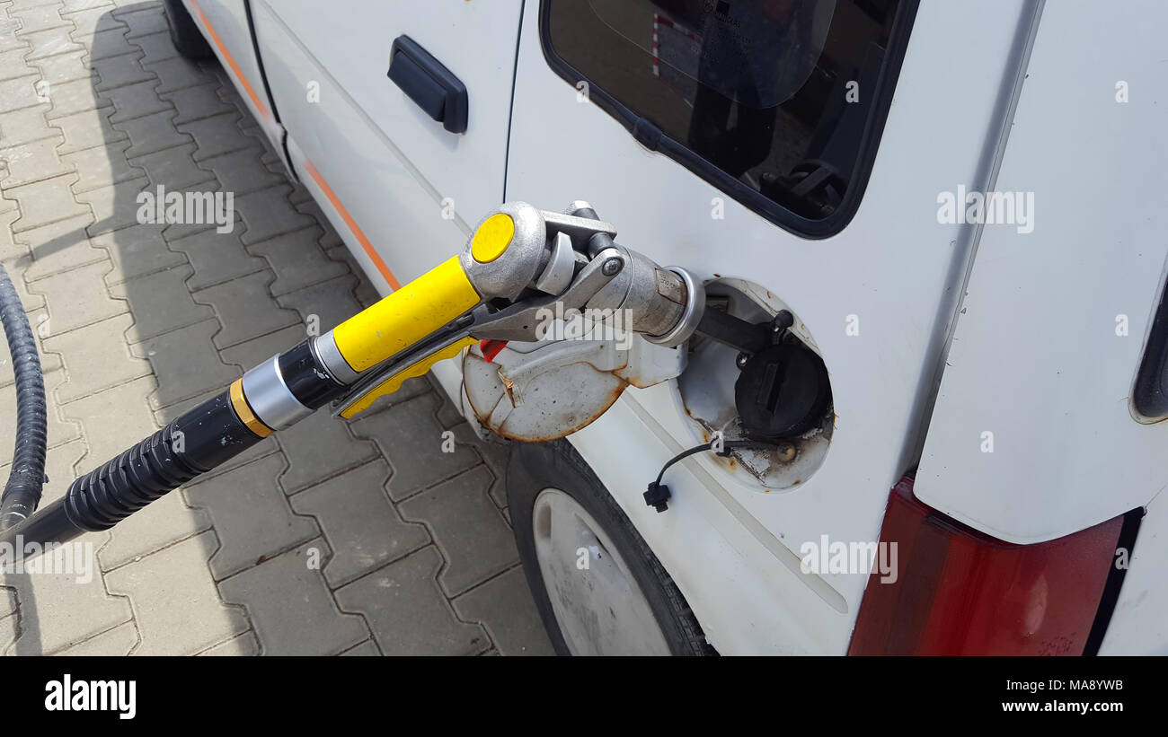 Pumping gas in car Stock Photo - Alamy