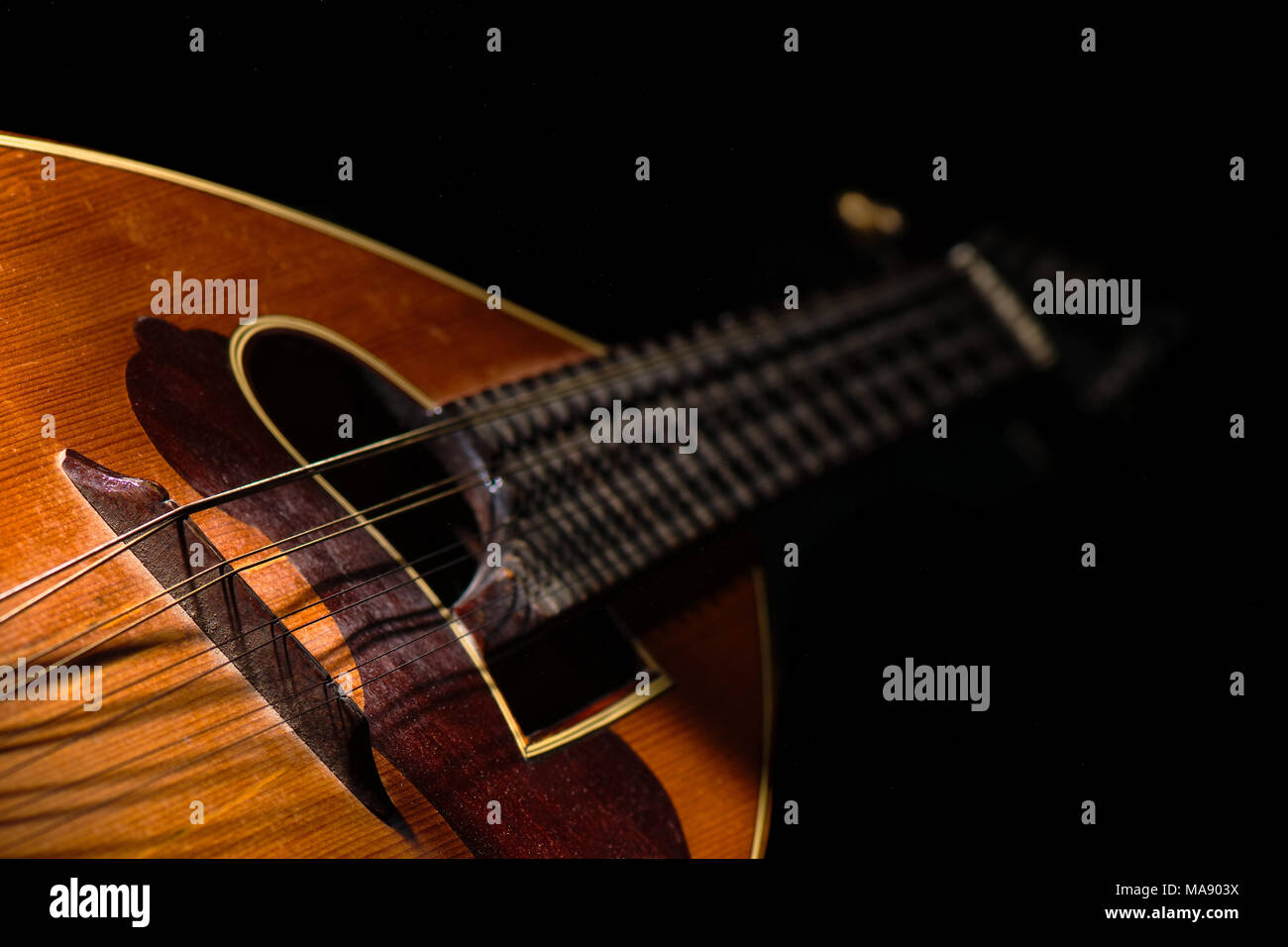 Detail of a Italian mandolin with black background Stock Photo - Alamy