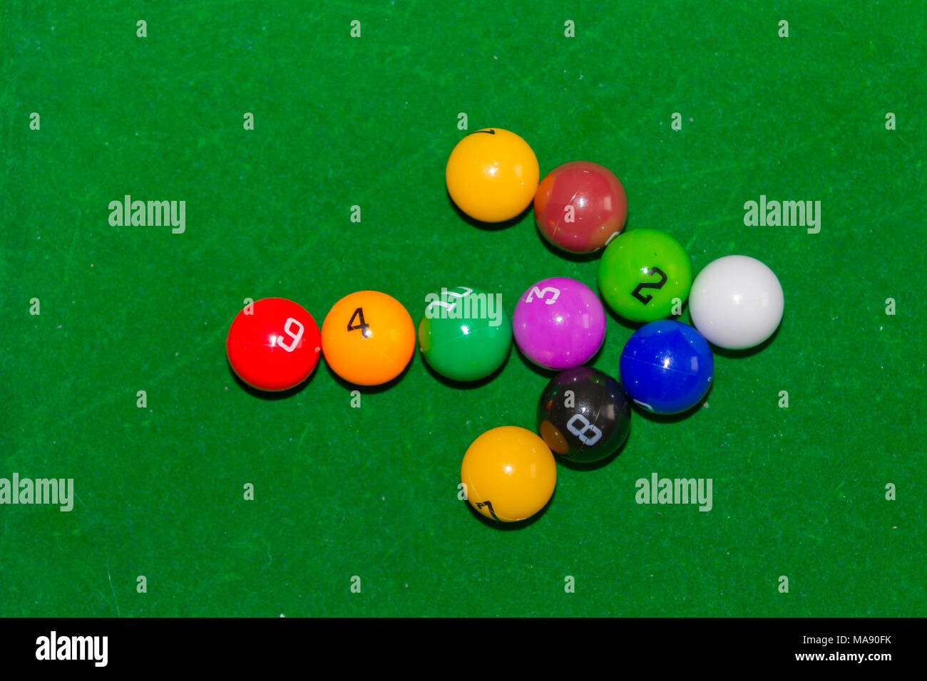Children's pool table game with multicolored balls Stock Photo - Alamy