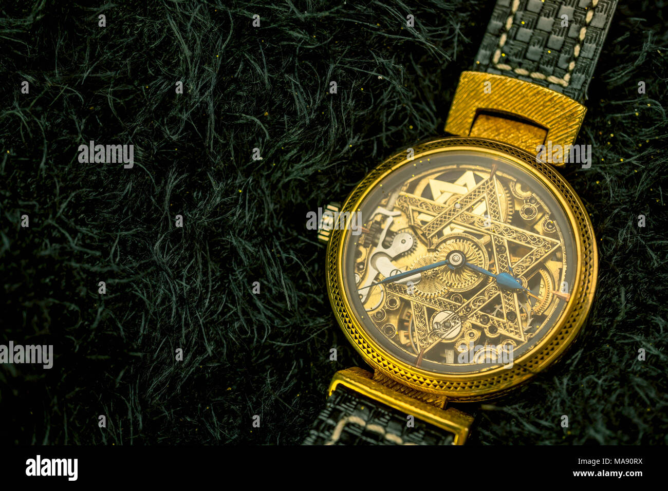 Vintage skeleton watch with Star of David on black fur background Stock ...