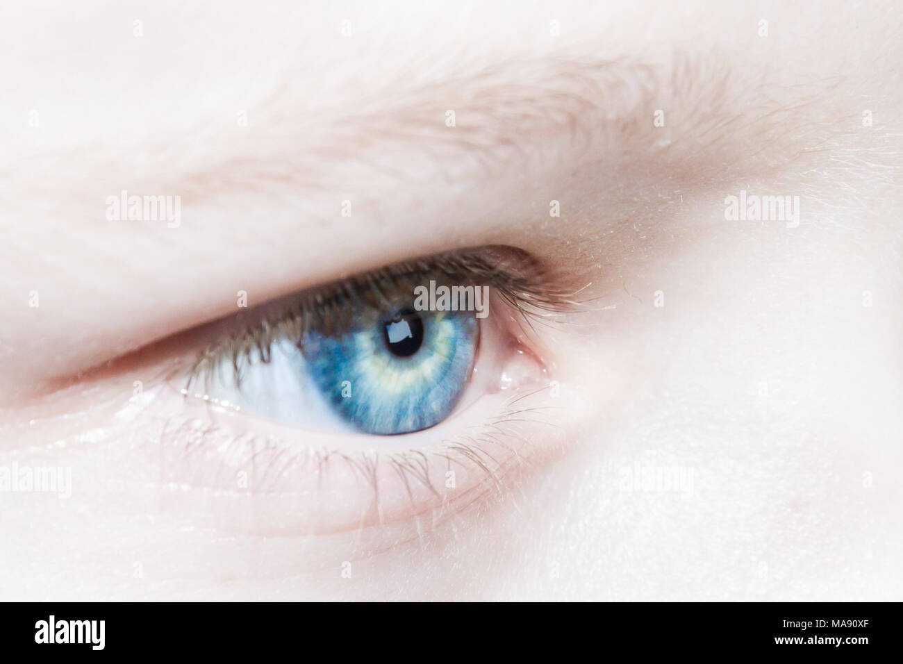 Baby blue beautiful, brooding eyes of a boy Stock Photo - Alamy