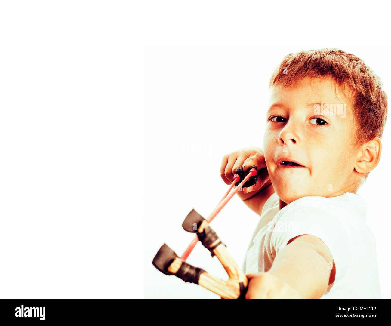 little cute angry real boy with slingshot isolated Stock Photo - Alamy