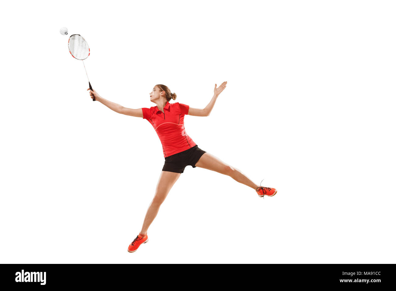 Young woman playing badminton over white background Stock Photo - Alamy