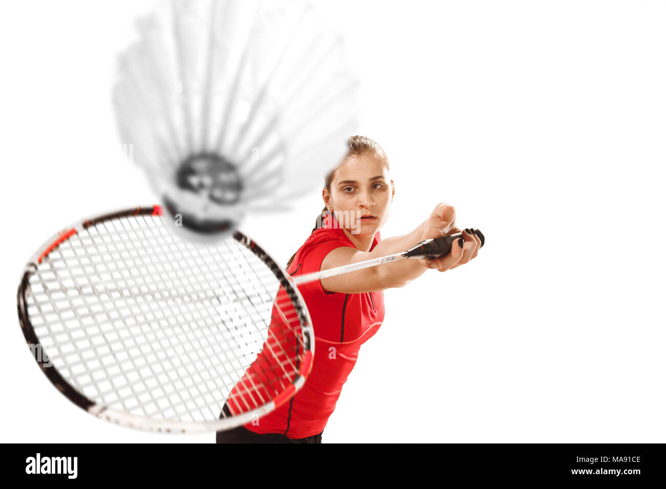 Young woman playing badminton over white background Stock Photo - Alamy