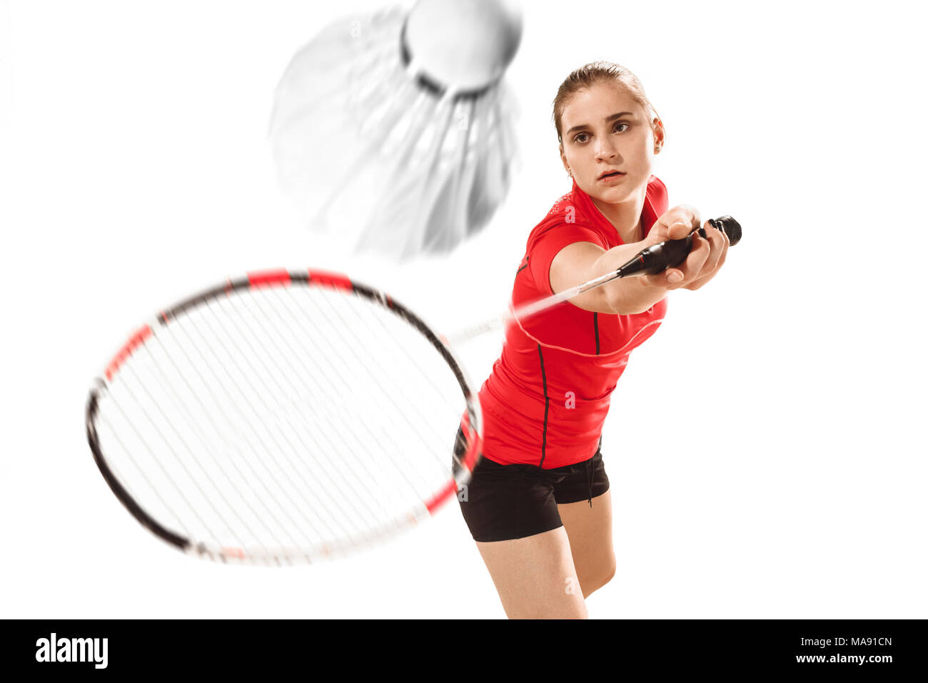 Young woman playing badminton over white background Stock Photo - Alamy