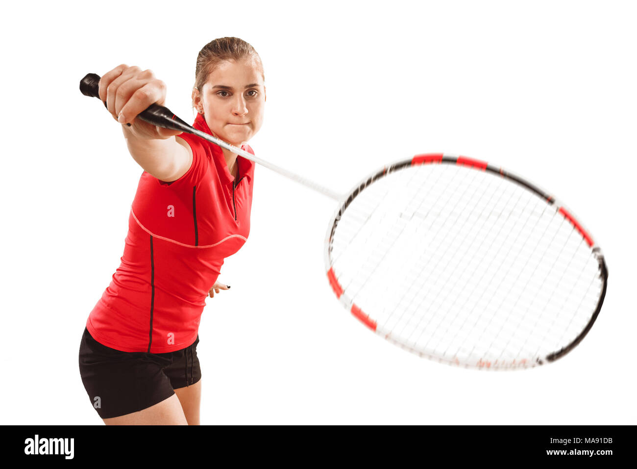 Young woman playing badminton over white background Stock Photo - Alamy