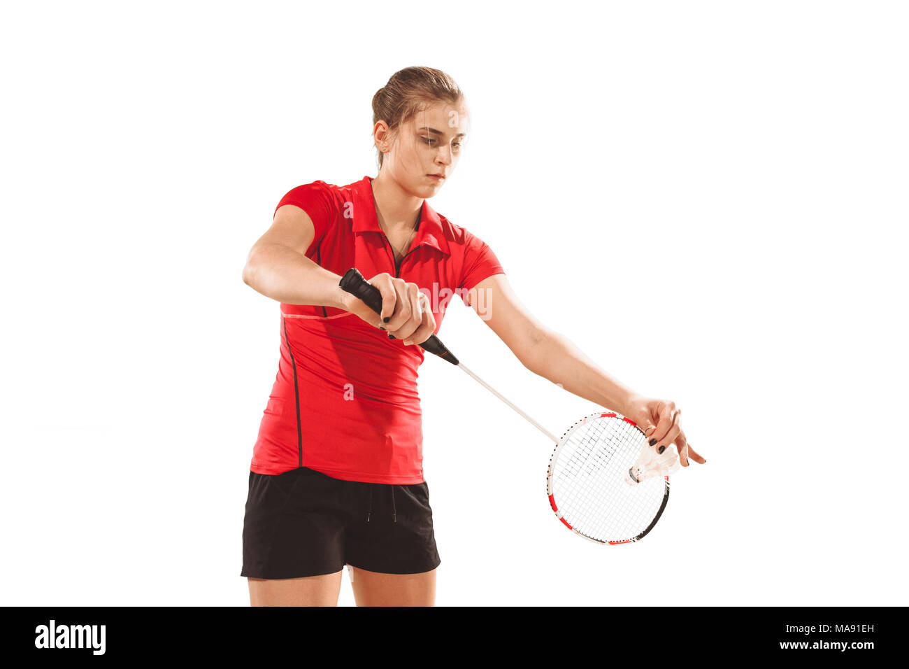 Young woman playing badminton over white background Stock Photo - Alamy