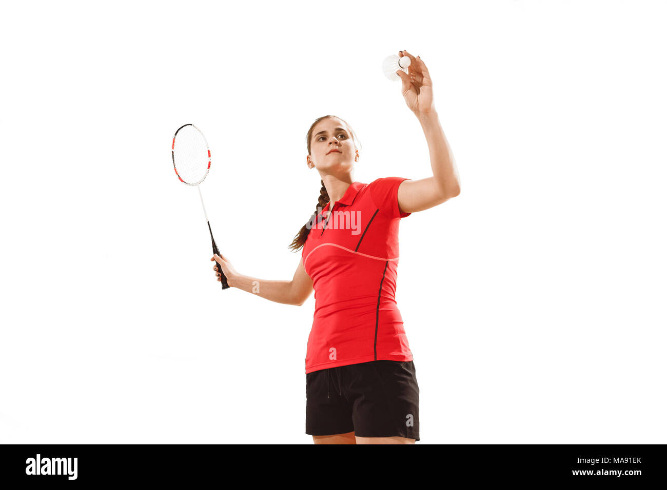 Young woman playing badminton over white background Stock Photo - Alamy