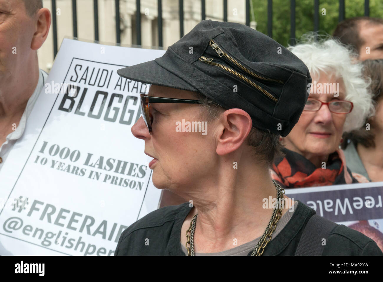People and a poster at letter hand-in to Downing St on Day of Action to ...