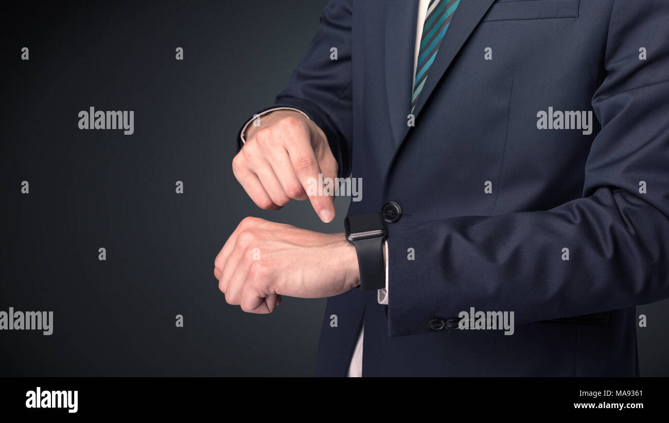 Man wearing suit with smartwatch on his wrist Stock Photo - Alamy
