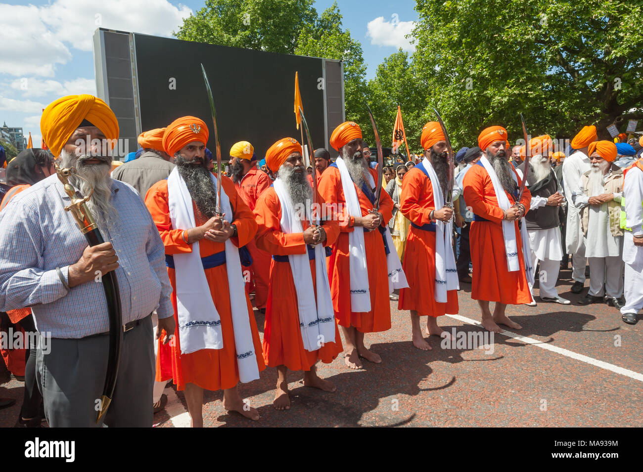 Five Khalsa representing the Blessed Ones with ceremonial swords raised ...