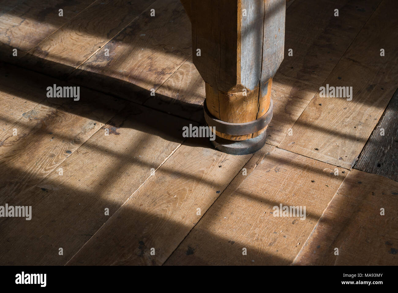 Interior of a historic wooden mill with a detail of an old wooden ...