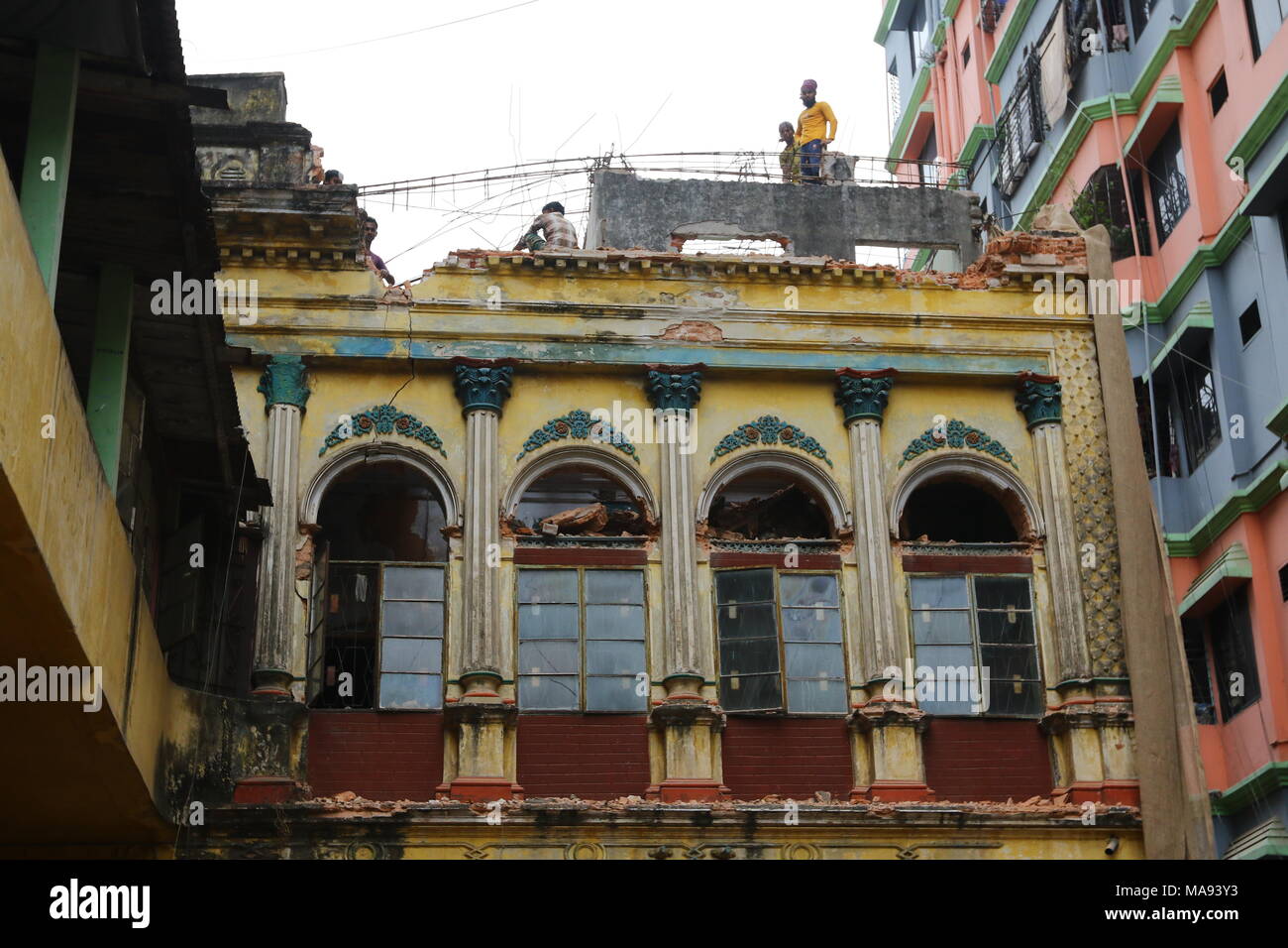 Dhaka 17 march 2018. worker hammering the roof of a heritage building ...