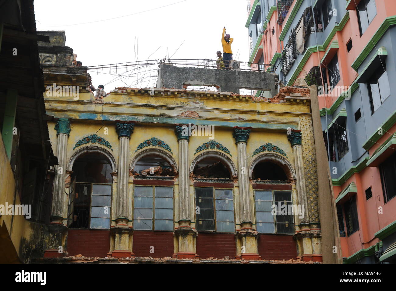 Dhaka 17 march 2018. worker hammering the roof of a heritage building ...
