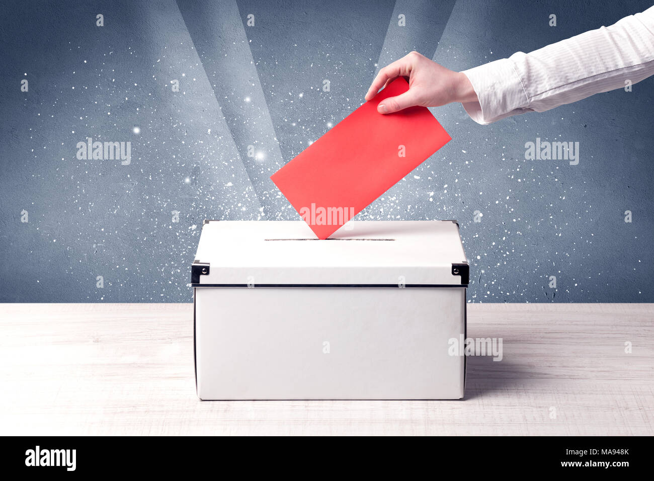 Ballot box with person casting vote on sparkling background Stock Photo ... Ballot box with person casting vote on sparkling background Stock Photo ...