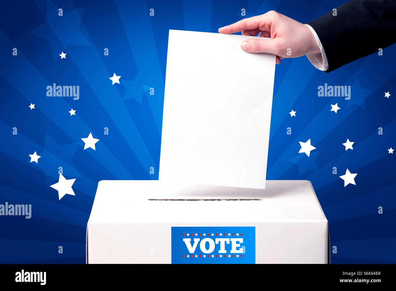 Voting hand with ballot and wooden box Stock Photo - Alamy