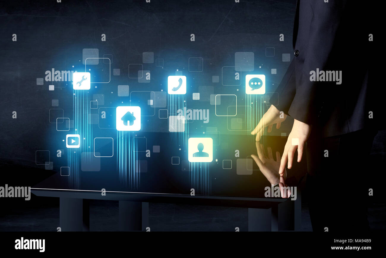 Modern smart table with high tech icons on its interface screen concept ...