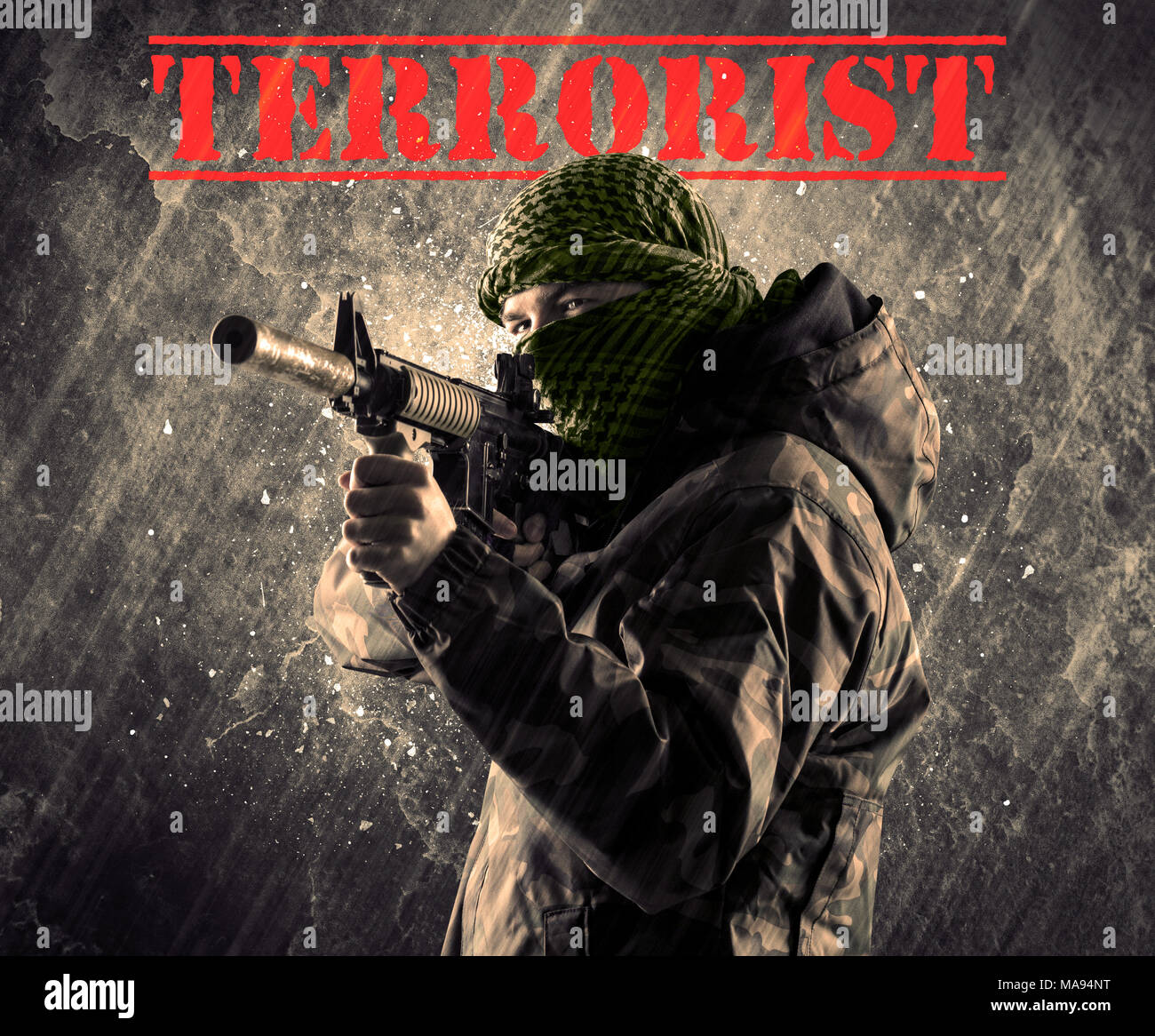 Portrait of dangerous masked and armed man with terrorist sign on ...