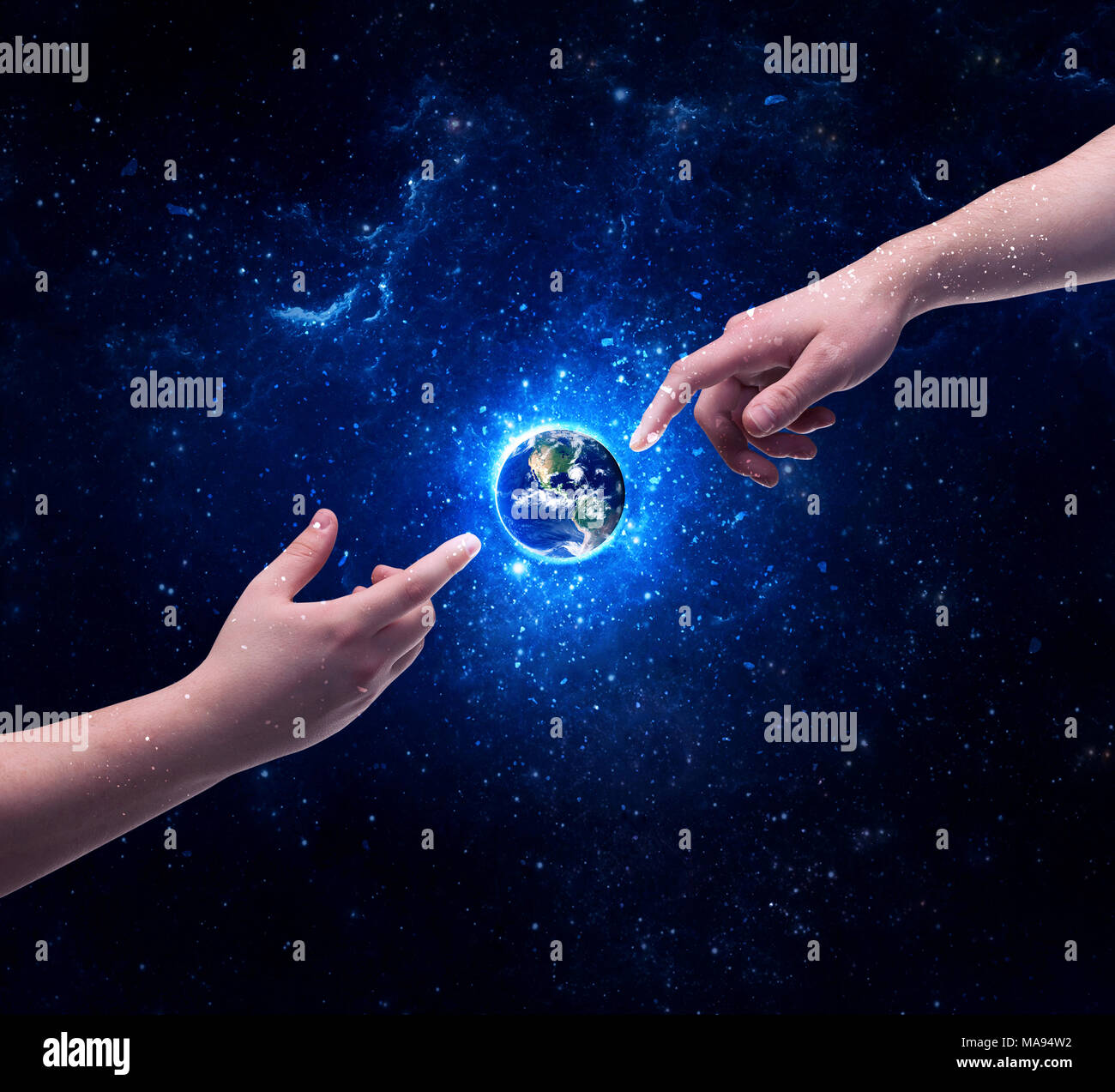 Male god hands about to touch the earth globe in the galaxy with bright ...