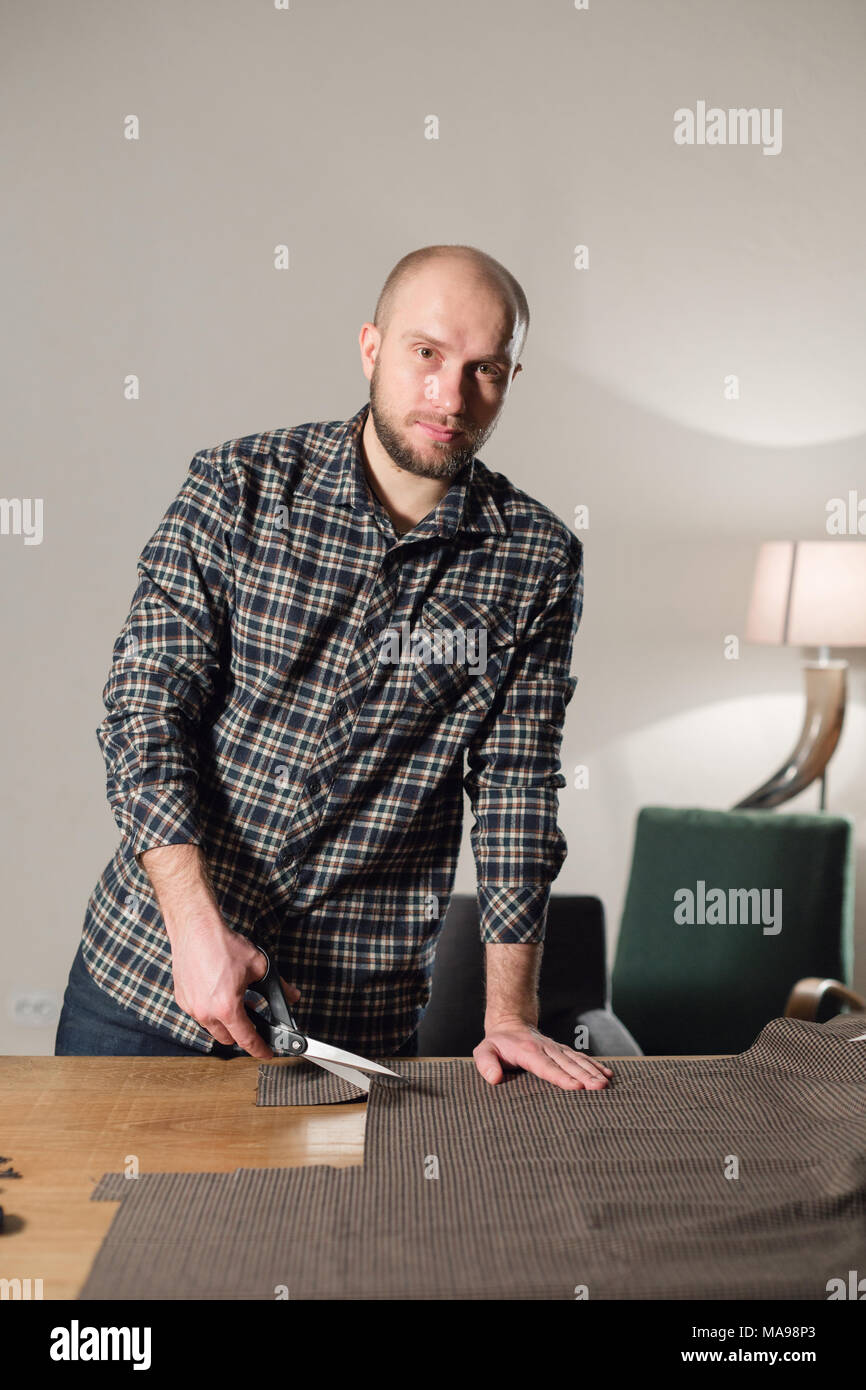 Cutting wool fabric. the line pattern. Bow ties of woolen fabric. Young ...