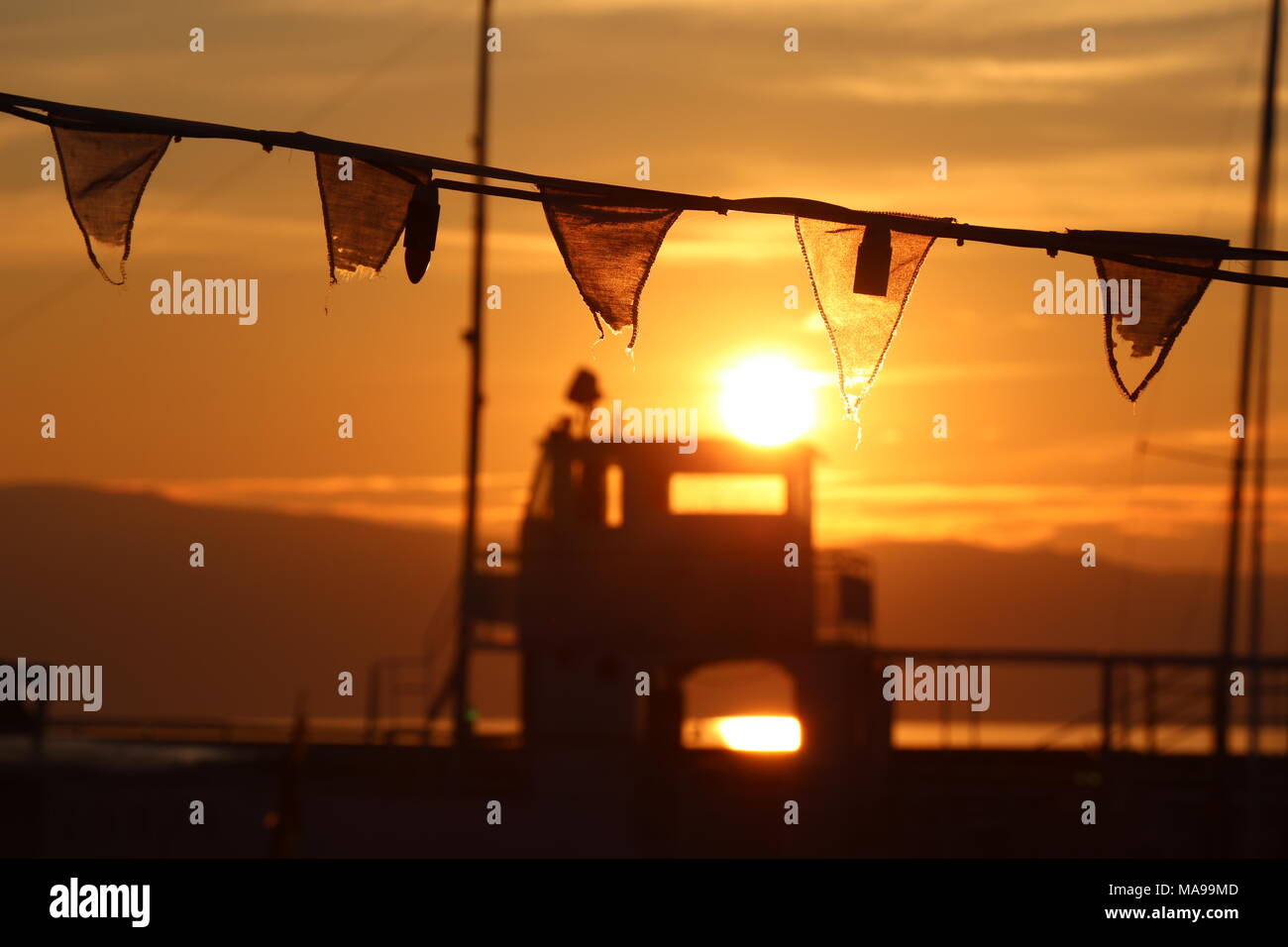 Golden dawn flags hi-res stock photography and images - Alamy