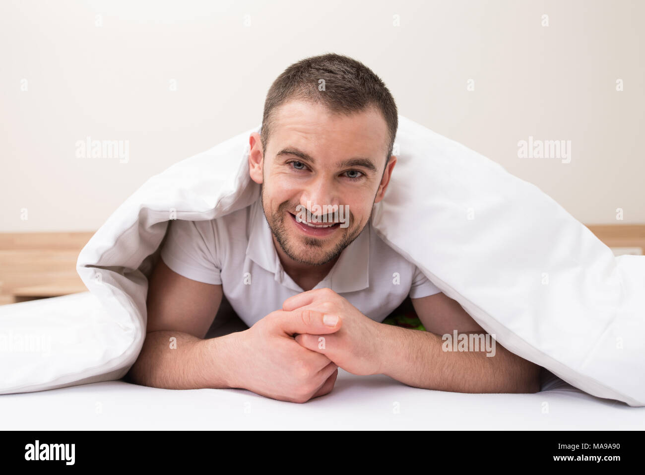 Person sleeping under a blanket hi-res stock photography and images - Alamy