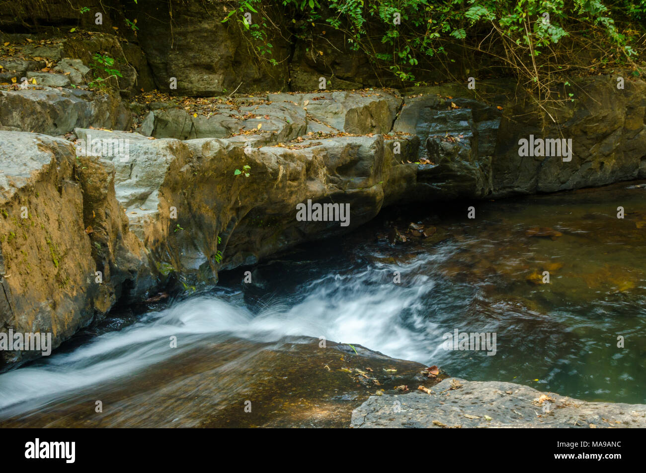 Swift stream gushing with clear mountain water en route Mainapi ...