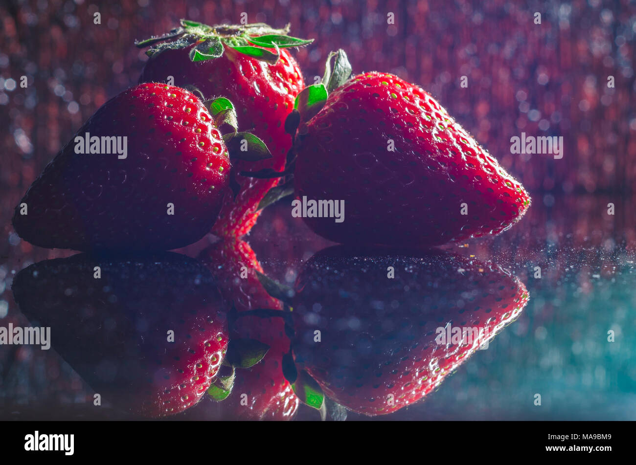 Colorful fresh strawberries with reflection Stock Photo - Alamy
